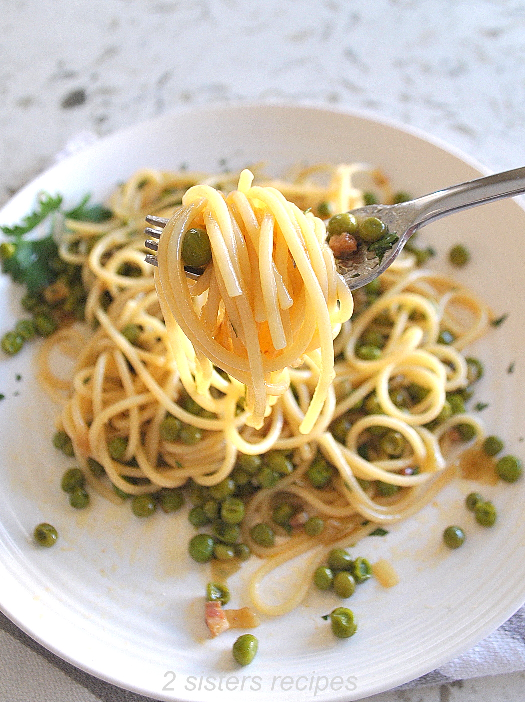 Spaghetti Tossed with Peas Onions and Pancetta - 2 Sisters Recipes by ...